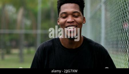 Young black man bursting laughing out loud outside. Person real life ...