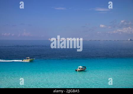 A small boat off the coast of Punta Sur on Isla Mujeres, Mexico Stock ...
