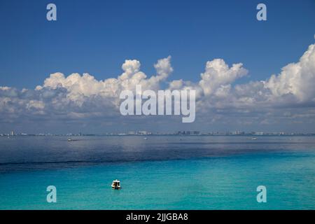 A small boat off the coast of Punta Sur on Isla Mujeres, Mexico Stock ...