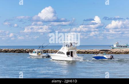 Boats leaving Montauk Harbor Stock Photo - Alamy