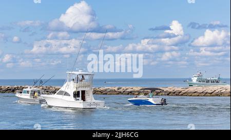 Boats leaving Montauk Harbor Stock Photo - Alamy