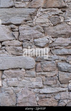 Gray stone wall background, mosaic stonewall rubble facade closeup ...