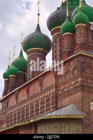 The Church of John the Baptist. Domes of a brick church with colored ...