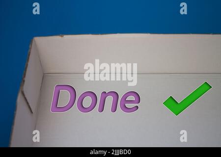 Done text with Checkmark with cardboard box. Brown folded cardbox Stock ...