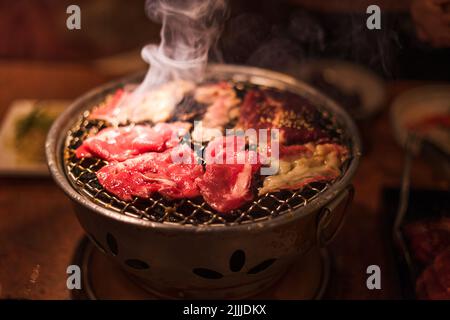 Grilling wagyu beef on charcoal grill ,Japanese barbecue roaster Stock ...