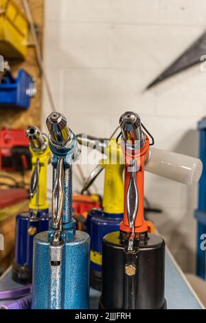 pneumatic Rivet Guns in a metal factory to fabricate Stock Photo - Alamy