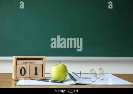 Cube calendar with date 1 SEPTEMBER, apple, books and eyeglasses on ...