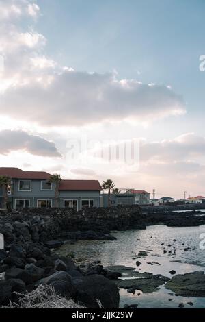 Geumneung Beach and seaside village in Jeju island, Korea Stock Photo ...
