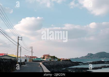 Geumneung Beach and seaside village in Jeju island, Korea Stock Photo ...