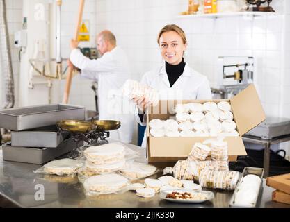 Workers kipping turron in food manufacture Stock Photo - Alamy