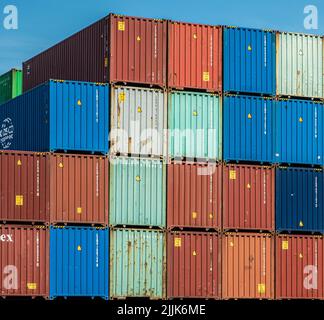 The brightly colored shipping containers stacked at the Port of ...