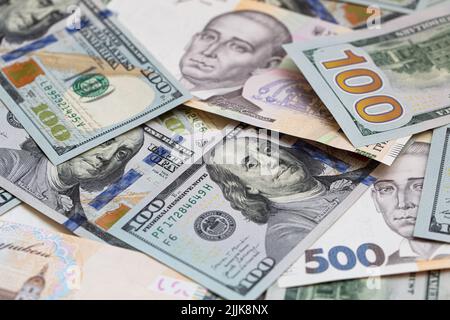 100 dollar and 500 hryvnyas banknotes background for design purpose ...