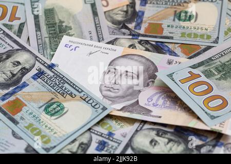 100 dollar and 500 hryvnyas banknotes background for design purpose ...