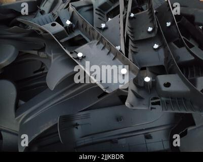Pile of used front bumper, rear bumper, and spoiler of car for recycle ...