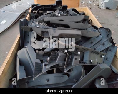 Pile of used front bumper, rear bumper, and spoiler of car for recycle ...