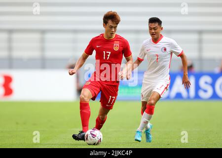 Law Tsz-Chun (7) of Hong Kong vies for the ball with Glenn Kweh Jia Jin ...