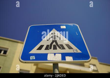 Low angle shot of a pedestrian crossing sign Stock Photo - Alamy