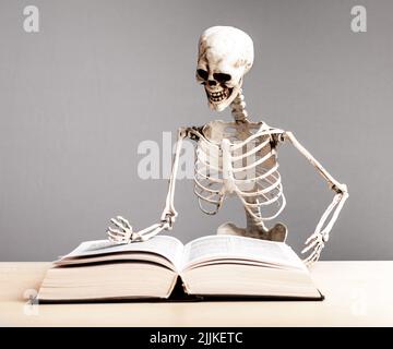 Burnout, tired and student with book on face laying on floor after ...