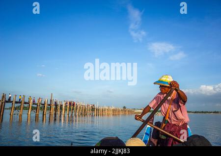 photo of man in boat in Myanmar travel lake Stock Photo - Alamy