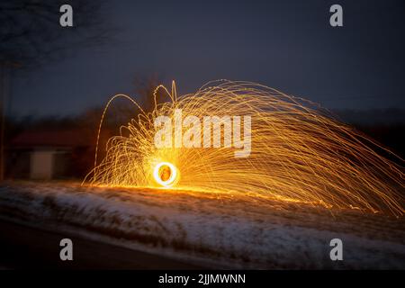 A beautiful vibrant gold circular wire wool at night Stock Photo - Alamy