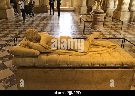 The historic sculpture of Hermaphroditus at the Louvre Museum in Paris ...