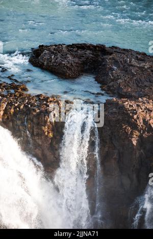 A vertical shot of the Gullfoss waterfall in Iceland on a sunny day ...