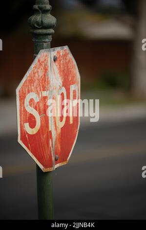 A vertical closeup shot of a Stop sign and one-way sign put on a ...