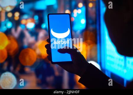 In this photo illustration, a Webull logo is seen displayed on a ...
