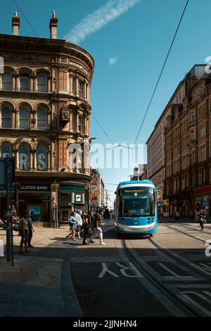 A West Midlands Metro tram travelling the tram lines along Broad Street ...