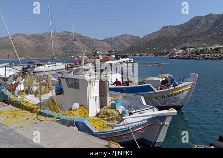 Traditional fishing boats and yachts, Livadia harbour and boats. Tilos ...