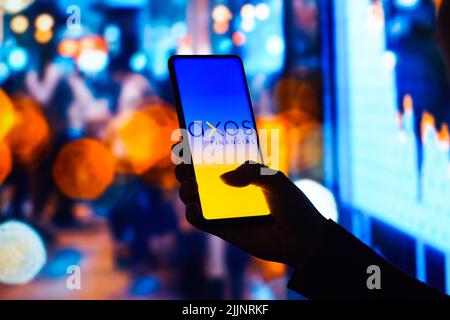 In this photo illustration, the Axos Financial logo is displayed on a ...