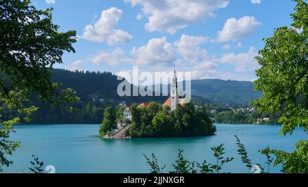A natural view of Catholic church situated on an island on the Bled ...