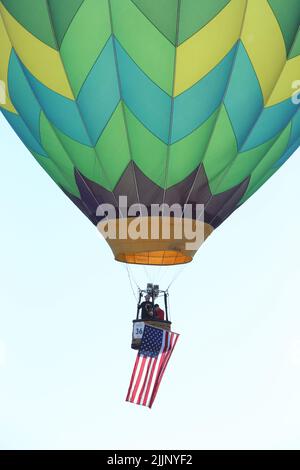 American flag waving in the air with a sky background. Fourth of July ...