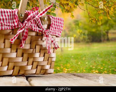 Picnic basket on a wooden table with strawberries Stock Photo - Alamy