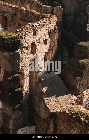 Vertical shot of the details of the facade of the Colosseum in Rome ...
