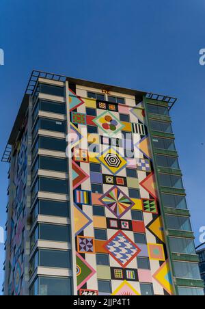 A vertical shot of the Berkeley Tower with Douglas Coupland mural ...