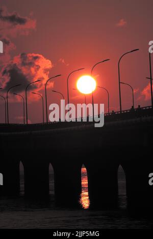 A vertical shot of the Sinamale Bridge during sunset in Maldives Stock ...