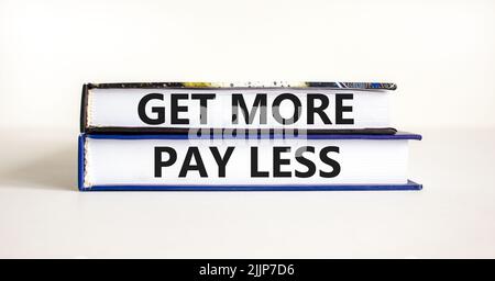 Get more pay less symbol. Concept words Get more pay less on books on a ...