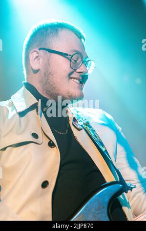 The Lathums band performing live at a concert, focus on lead guitarist ...