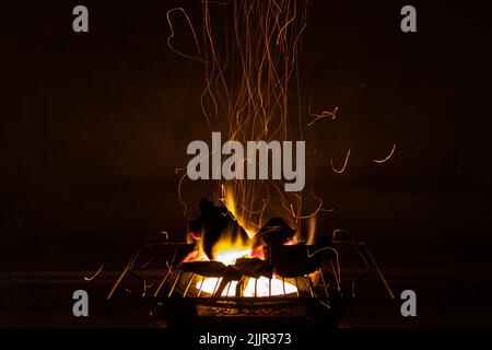 Closeup shot of smoke in the darkness with purple and red lighting ...