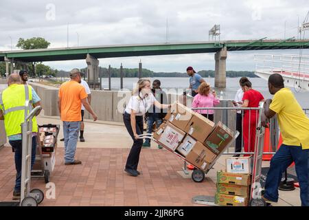 Crew members loading food and supplies on the American Countess ...
