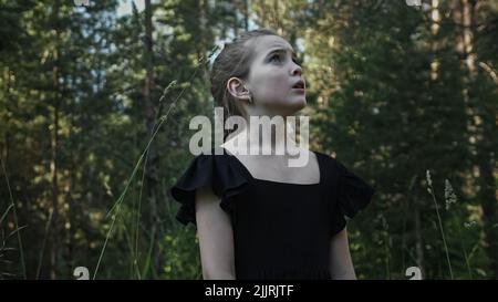 Schoolgirl lost in dark forest and screams crying closeup Stock Photo ...