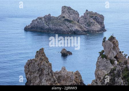 Skeludi islet seen from shore in Palaiokastritsa famous resort town on ...