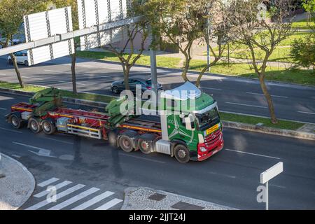 a photo of a truck carrying tools on the road in Lisbon Stock Photo - Alamy