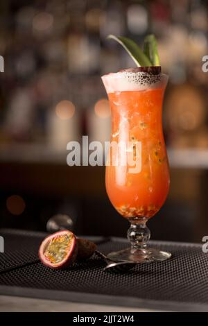 A closeup shot of a cocktail with passion fruit Stock Photo - Alamy