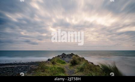 A rocky cliff overseeing the ocean view Stock Photo - Alamy