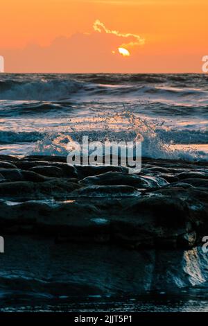 The pattern of waves in the sea during the sunset on the beach Stock ...