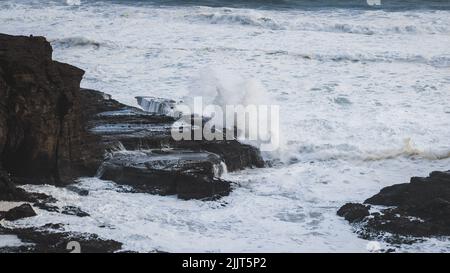 A big waves hitting the seashore Stock Photo - Alamy