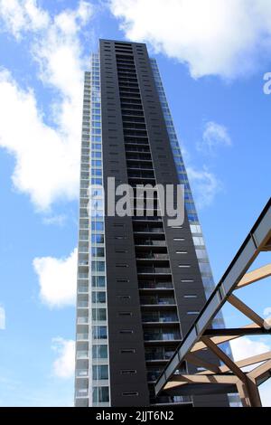 A high angle shot of buildings against a blue seascape in Izola ...
