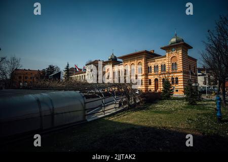 The exterior design of City hall of Brcko district with two flags in ...